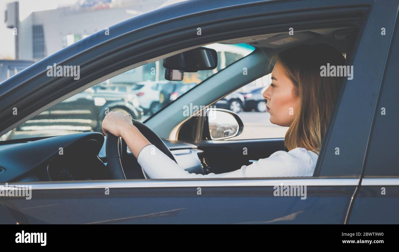 Woman car alone happy drive view hi-res stock photography and images ...