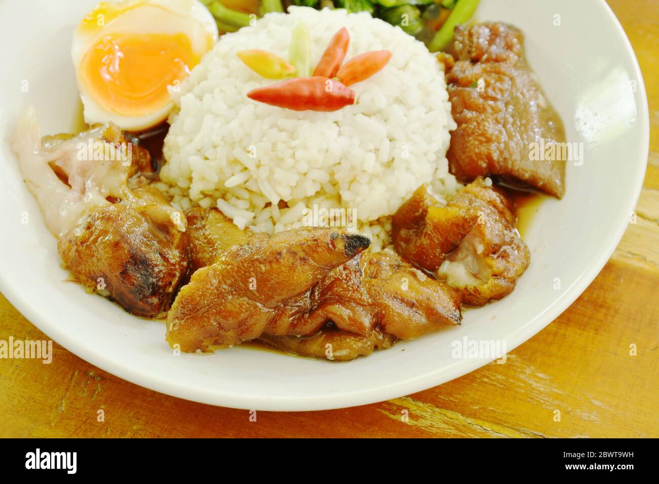 pork trotters stew and boiled egg with rice on plate Stock Photo - Alamy