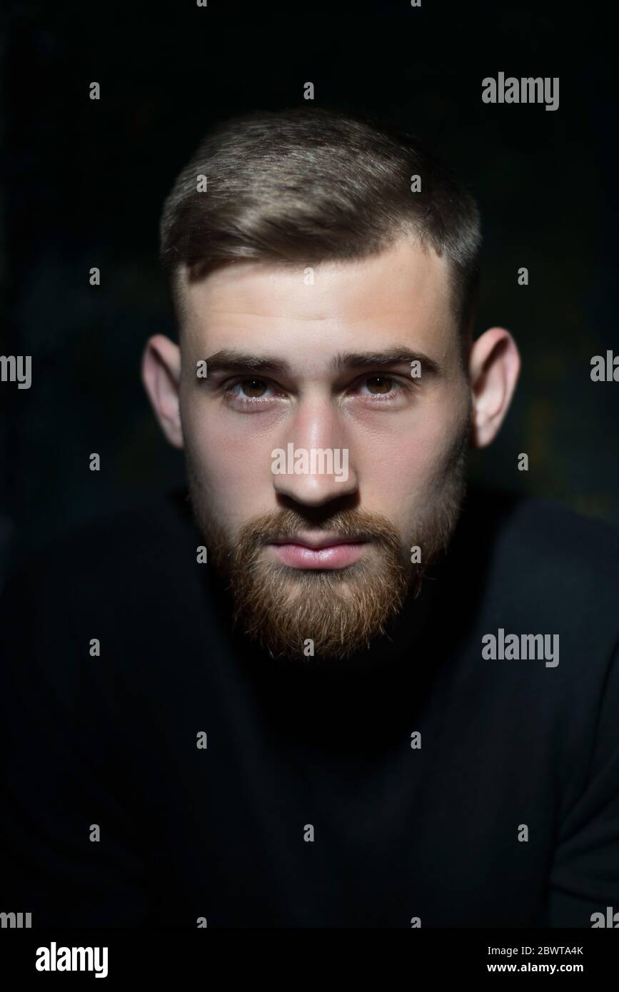 portrait of a bearded eared young guy of twenty-five years old, in ...