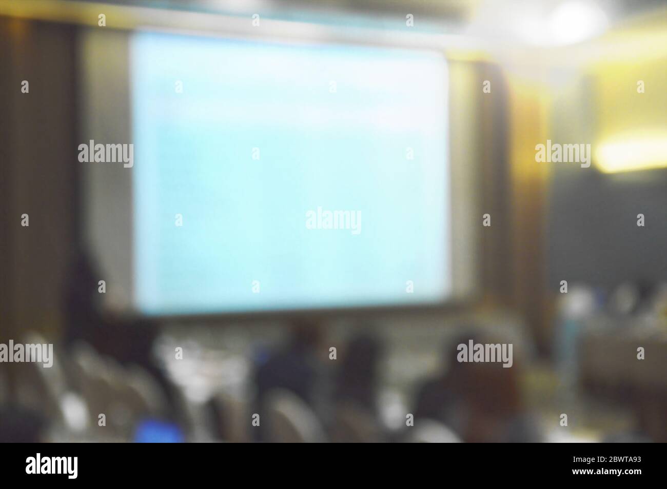 blur of projector screen in meeting room Stock Photo - Alamy