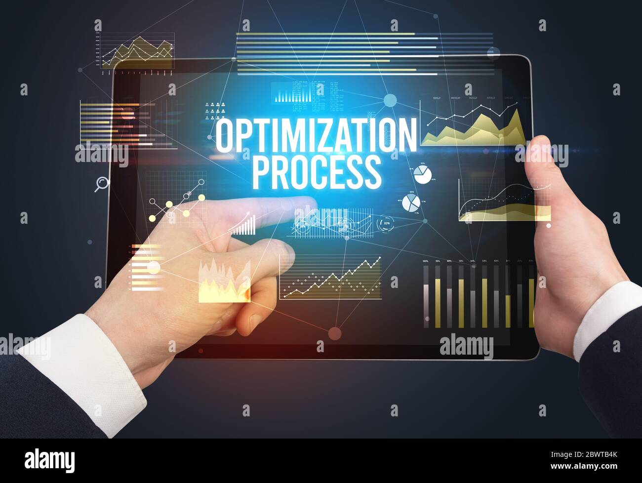 Close-up of hands holding tablet with OPTIMIZATION PROCESS inscription ...