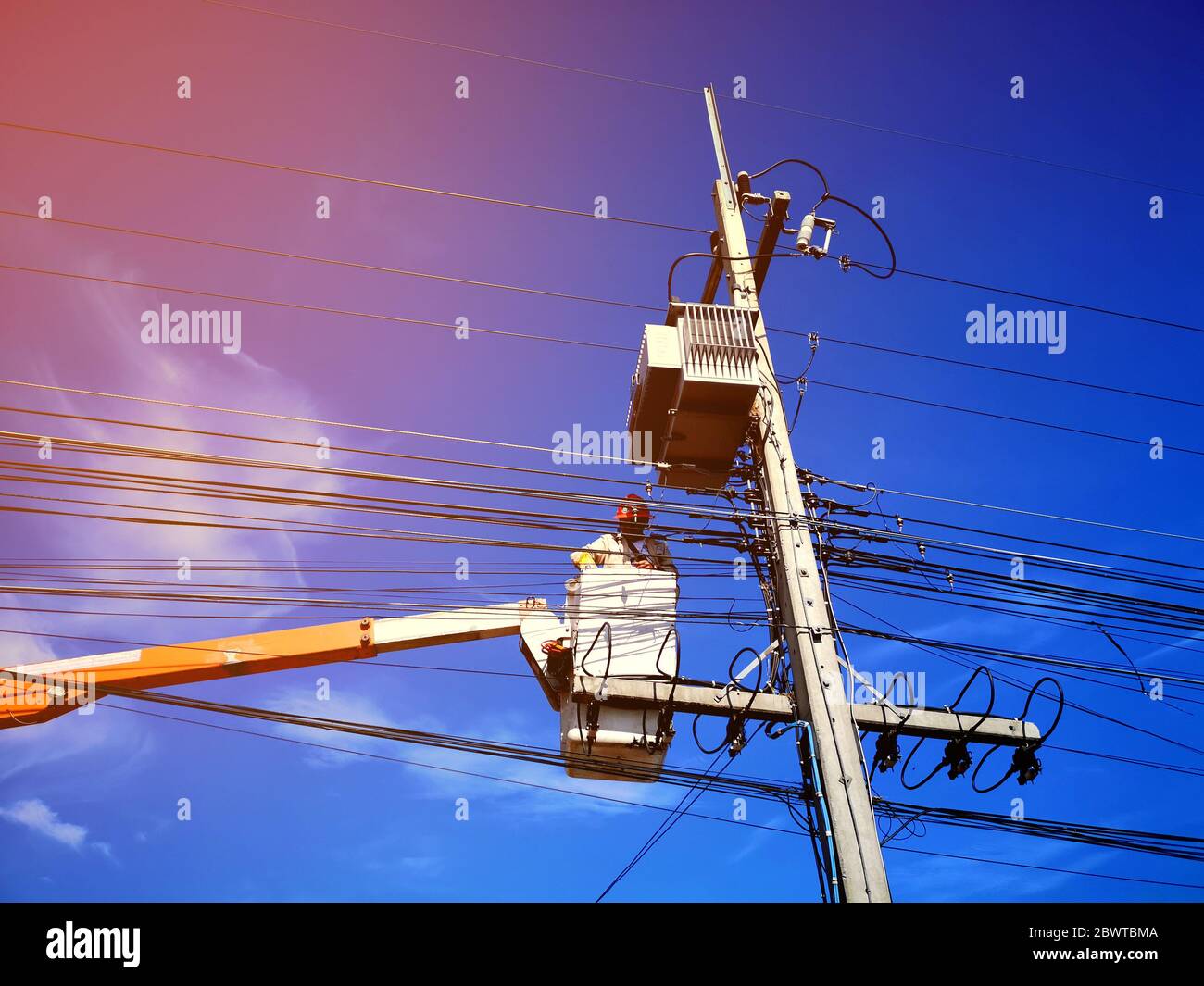 power electrician lineman at work on pole and cable car Stock Photo - Alamy