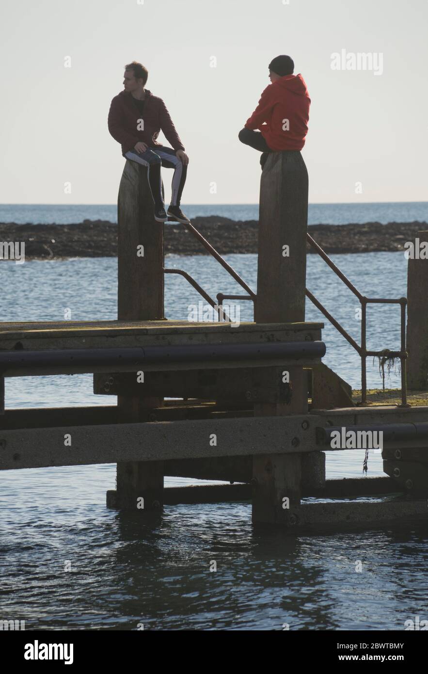 People relaxing on seafront after Welsh government eased lockdown ...