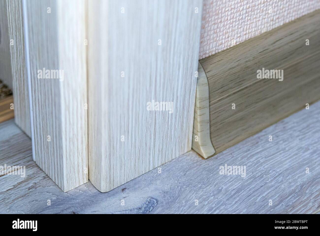 Joining the baseboard to the door frame. End cap on plastic baseboard ...