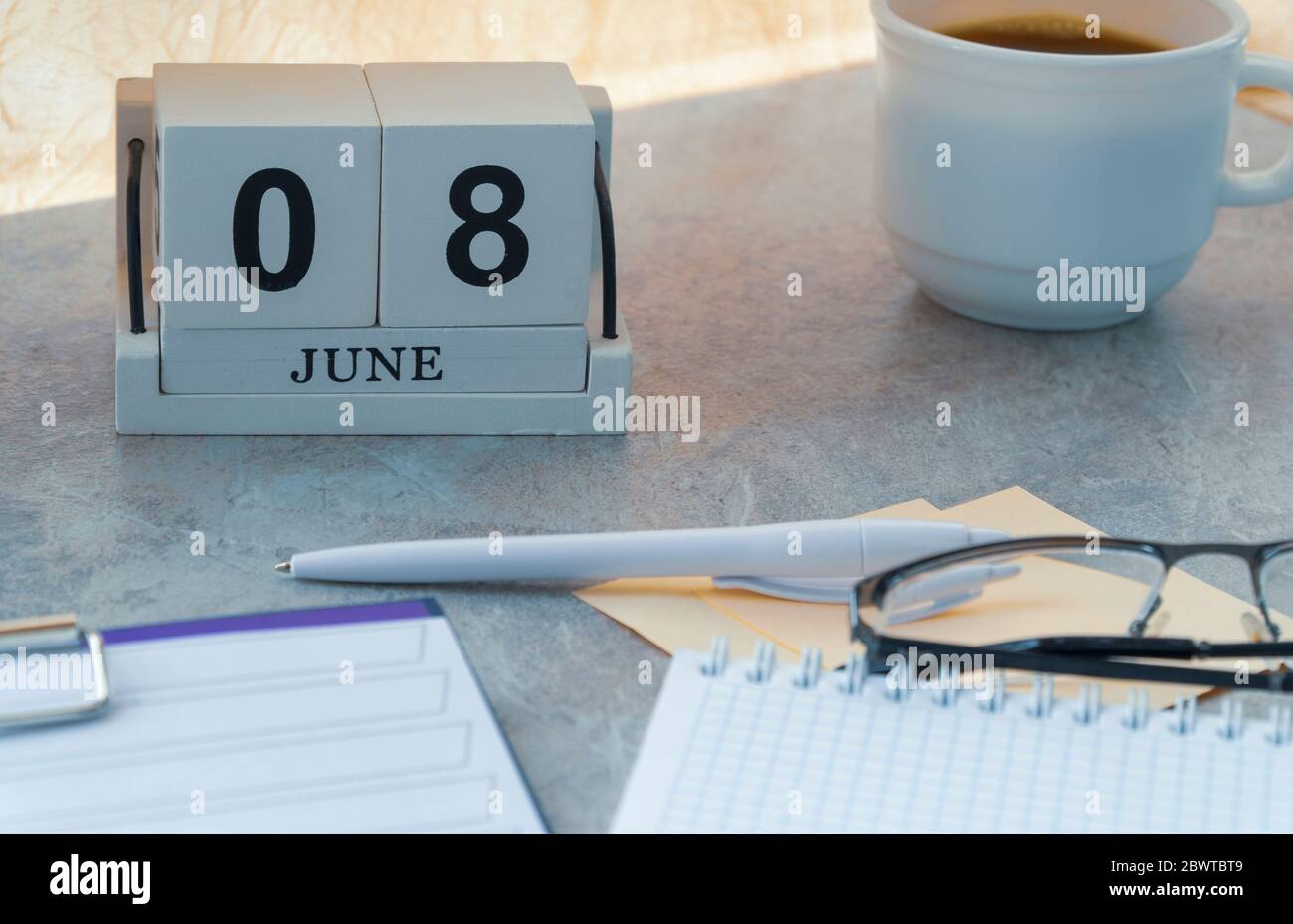 June 08, date on the calendar. Handmade wood cube with date month and ...