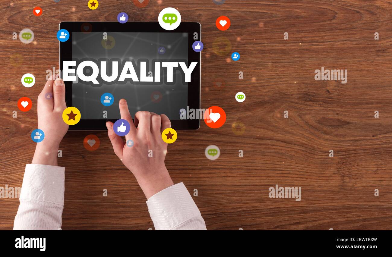 Close-up of a touchscreen with EQUALITY inscription, social networking ...
