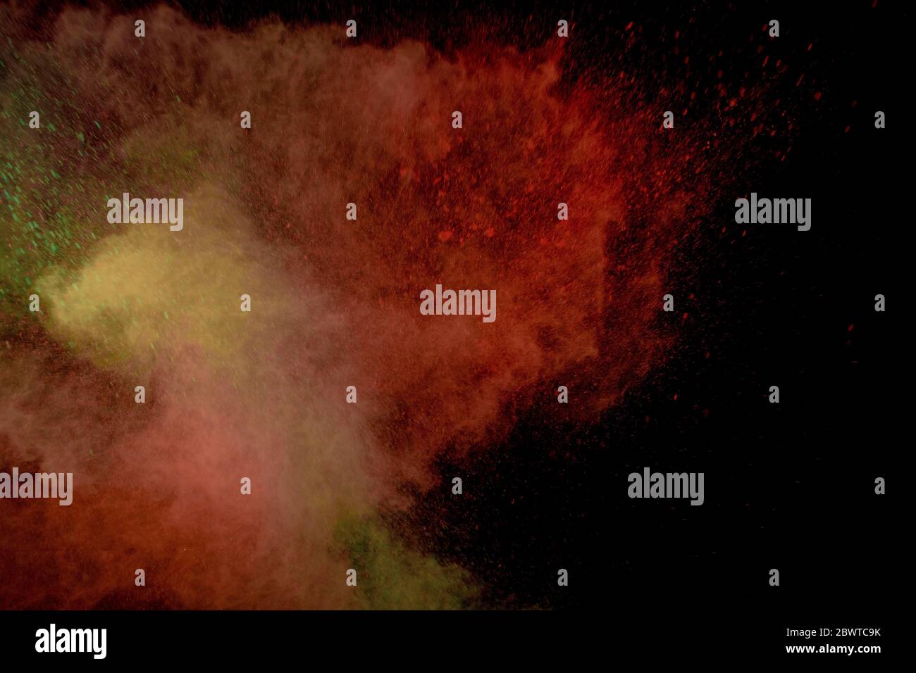 Abstract colored dust explosion on a black background.abstract powder ...