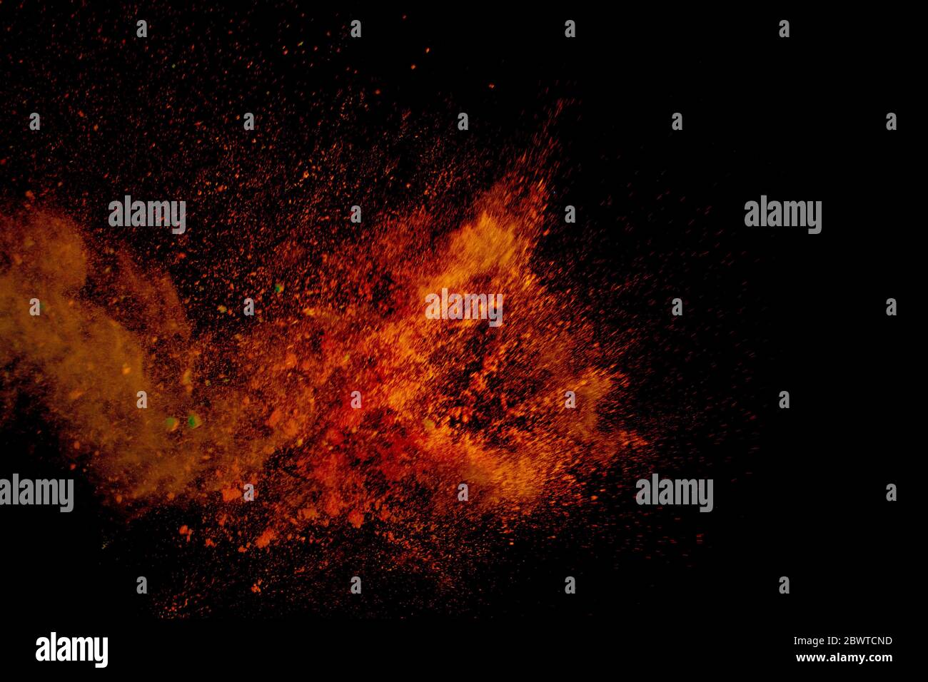 Abstract colored dust explosion on a black background.abstract powder ...