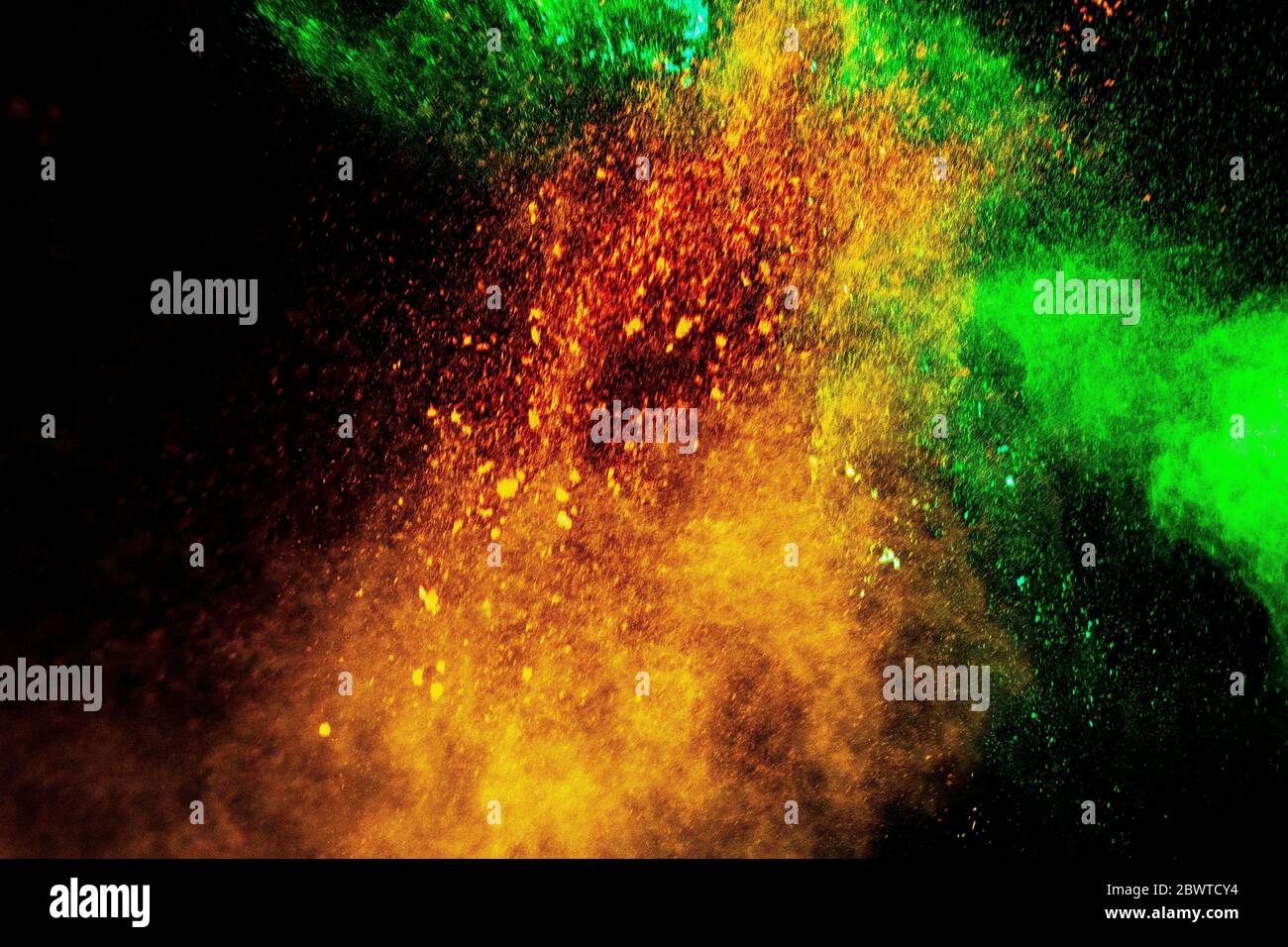 Abstract colored dust explosion on a black background.abstract powder ...