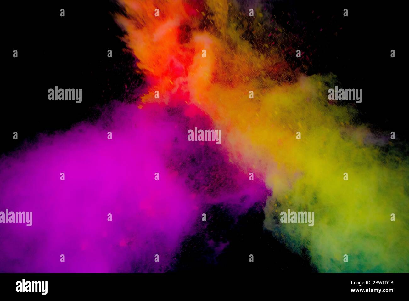 Abstract colored dust explosion on a black background.abstract powder ...