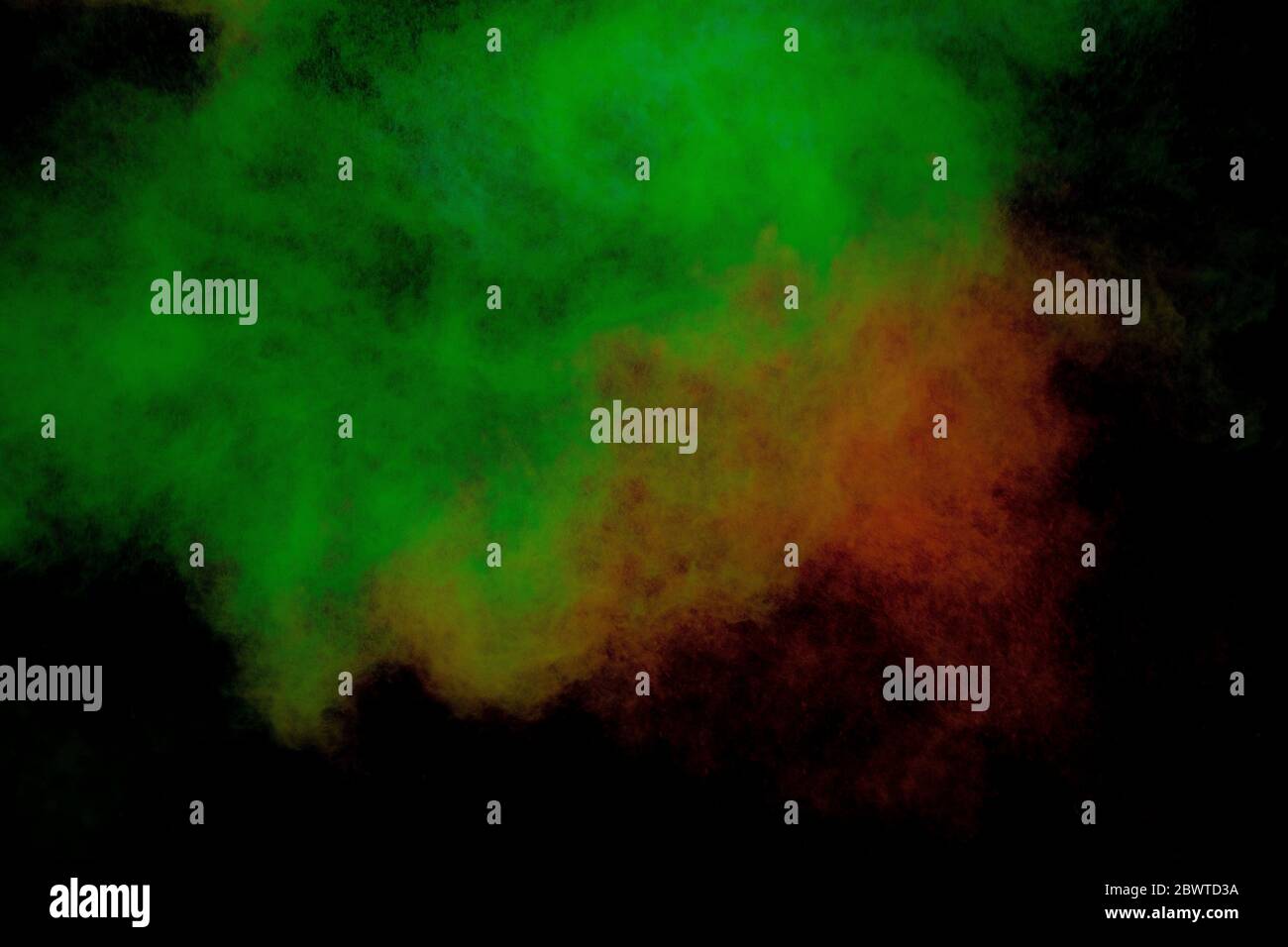 Abstract colored dust explosion on a black background.abstract powder ...