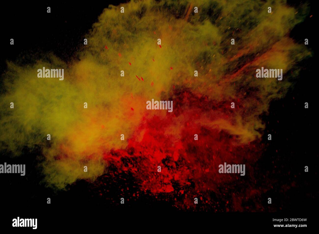 Abstract colored dust explosion on a black background.abstract powder ...