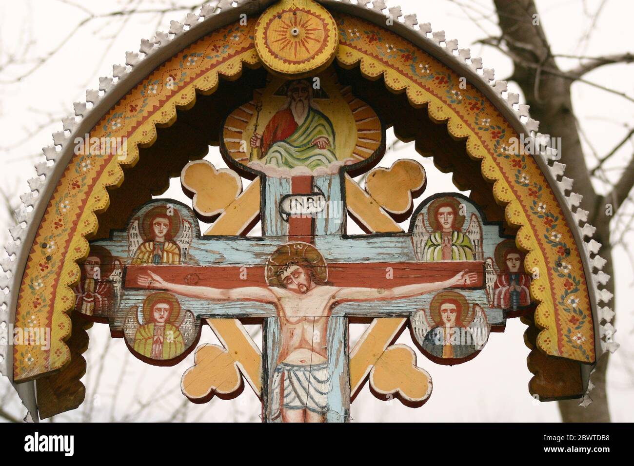 Roadside crucifix in Romania's countryside. Traditionally sculpted ...