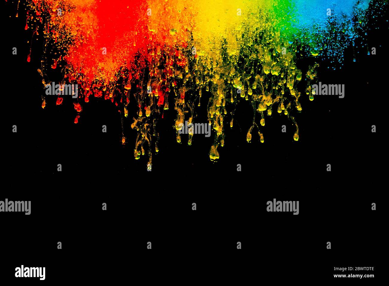 Abstract colored dust explosion on a black background.abstract powder ...