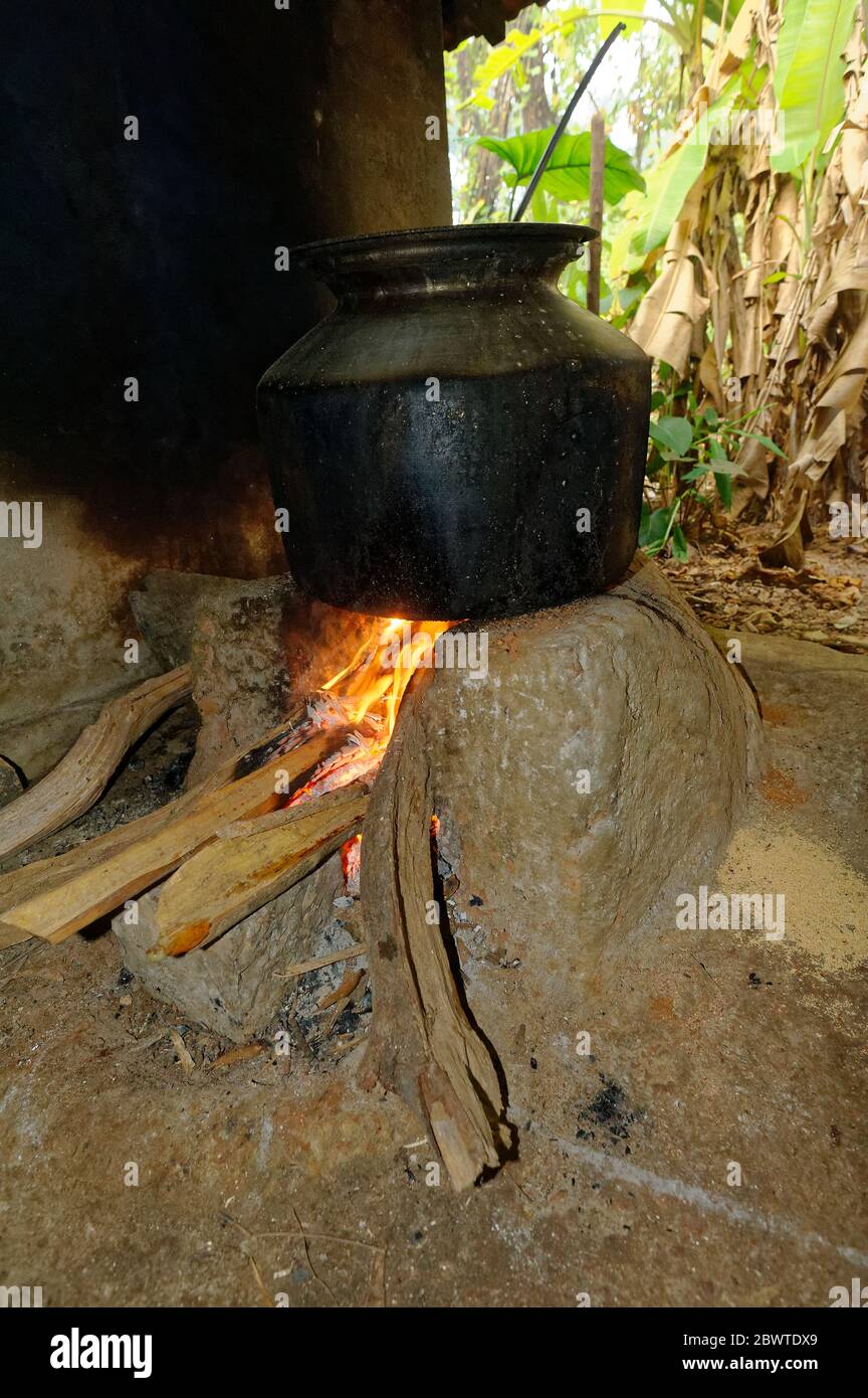 Boiling water on an open fire in rural Indian village Stock Photo - Alamy