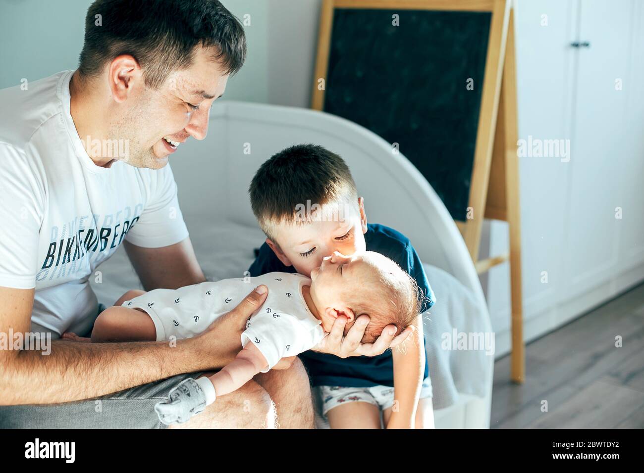 Father's hand hugging cute newborn son. Little baby with father and ...