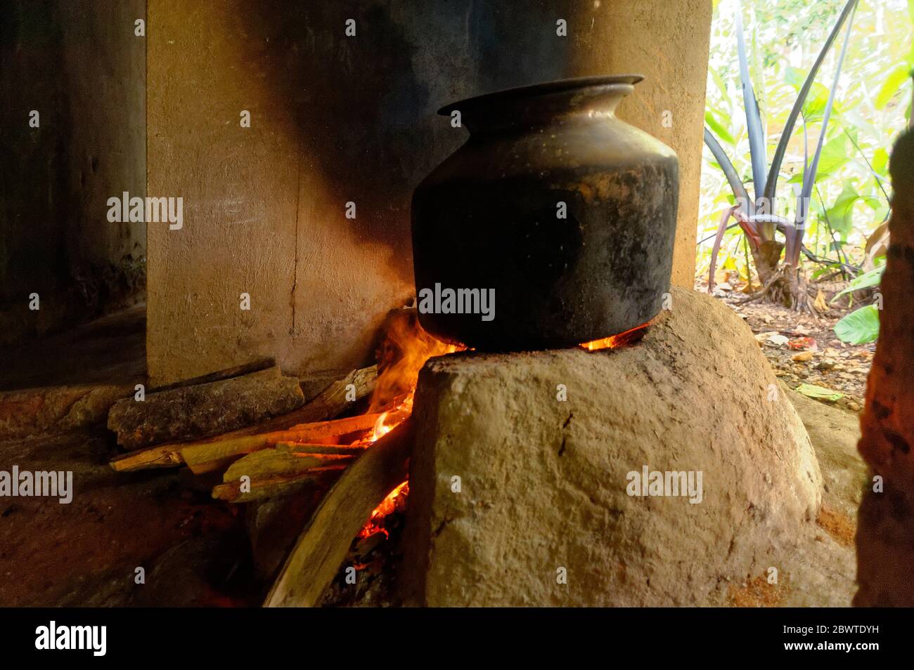 Boiling water on an open fire in rural Indian village Stock Photo - Alamy