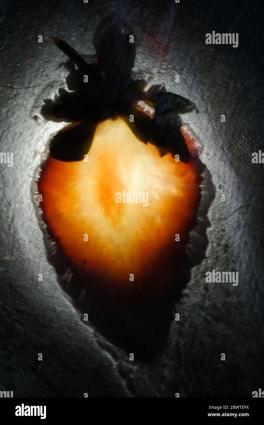 Strawberry slice under wet kitchen roll sheet Stock Photo - Alamy