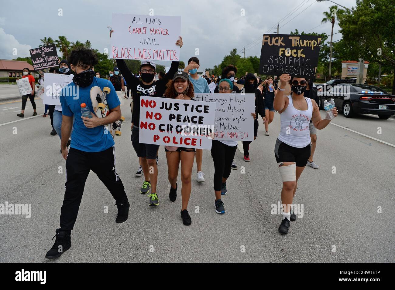 PLANTATION, FL - JUNE 02: Protestors holding signs and marching as they ...