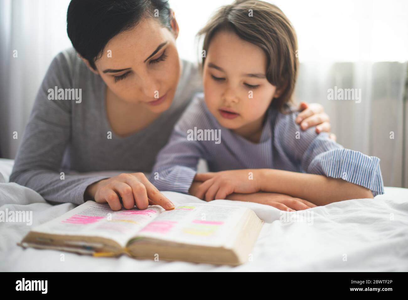 Family praying bed hi-res stock photography and images - Alamy