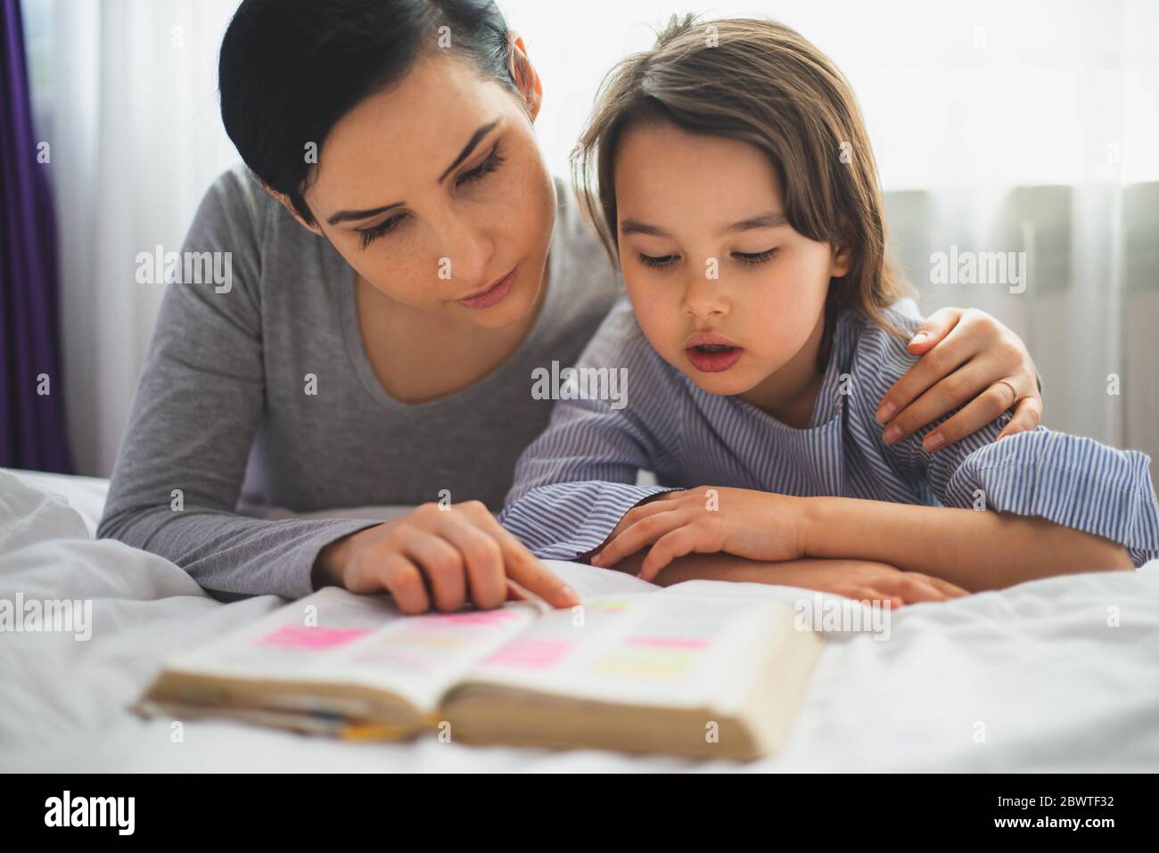 Family praying bed hi-res stock photography and images - Alamy