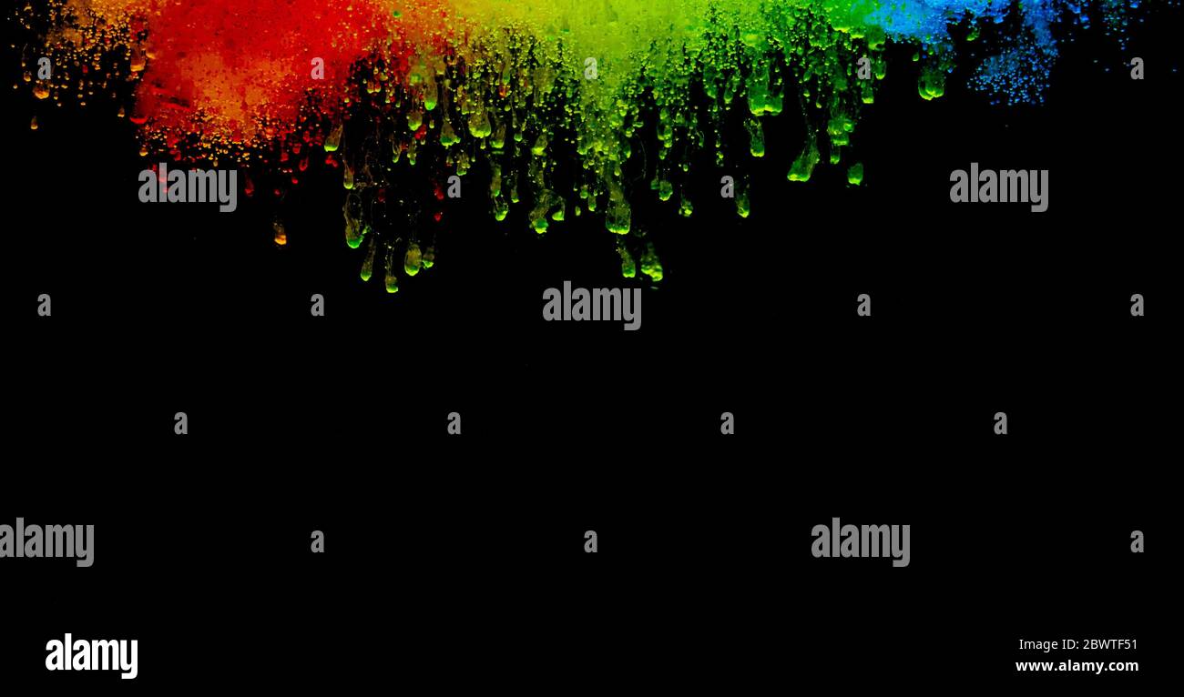 Abstract colored dust explosion on a black background.abstract powder ...