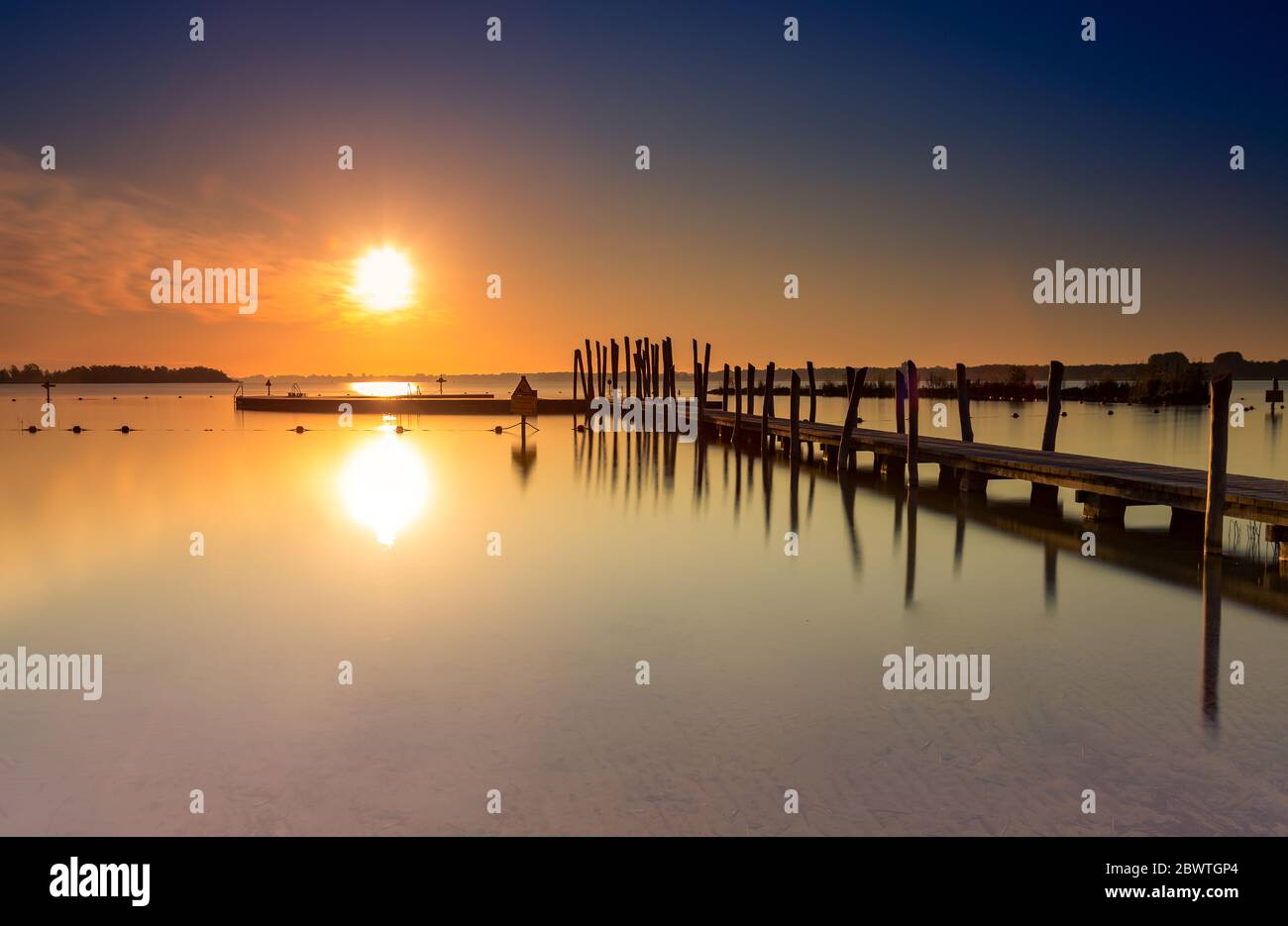 Beach jetty and Outdoor swimming pool at the Wijderwold lake during an ...
