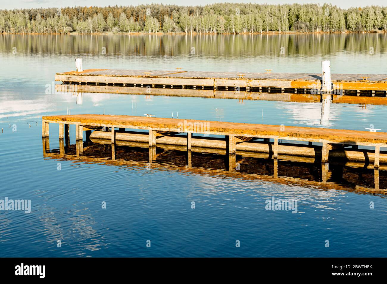 brown boat pier on the river Stock Photo - Alamy