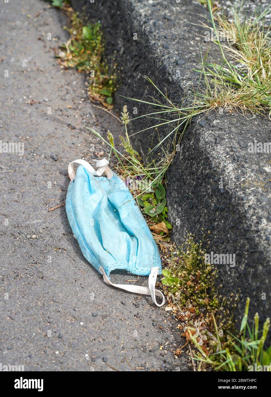 Waste rubbish in a street gutter hi-res stock photography and images ...
