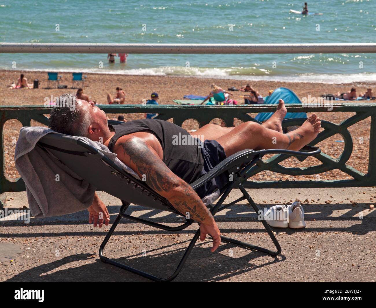 Enjoying the sunshine at the beach hi-res stock photography and images ...