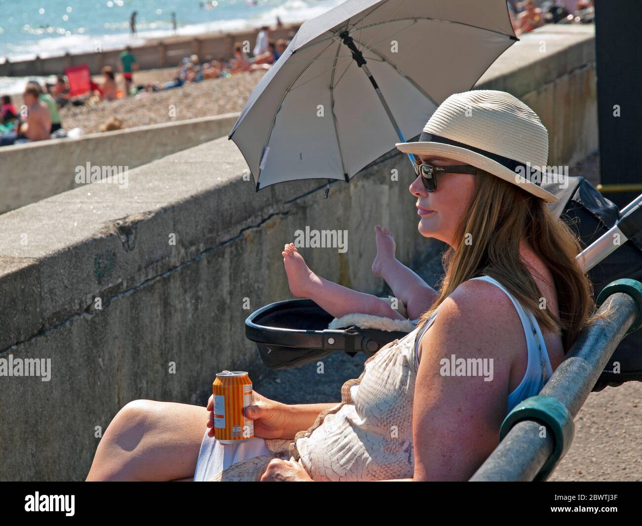 Mum and her little baby on the seafront in Brighton Stock Photo - Alamy