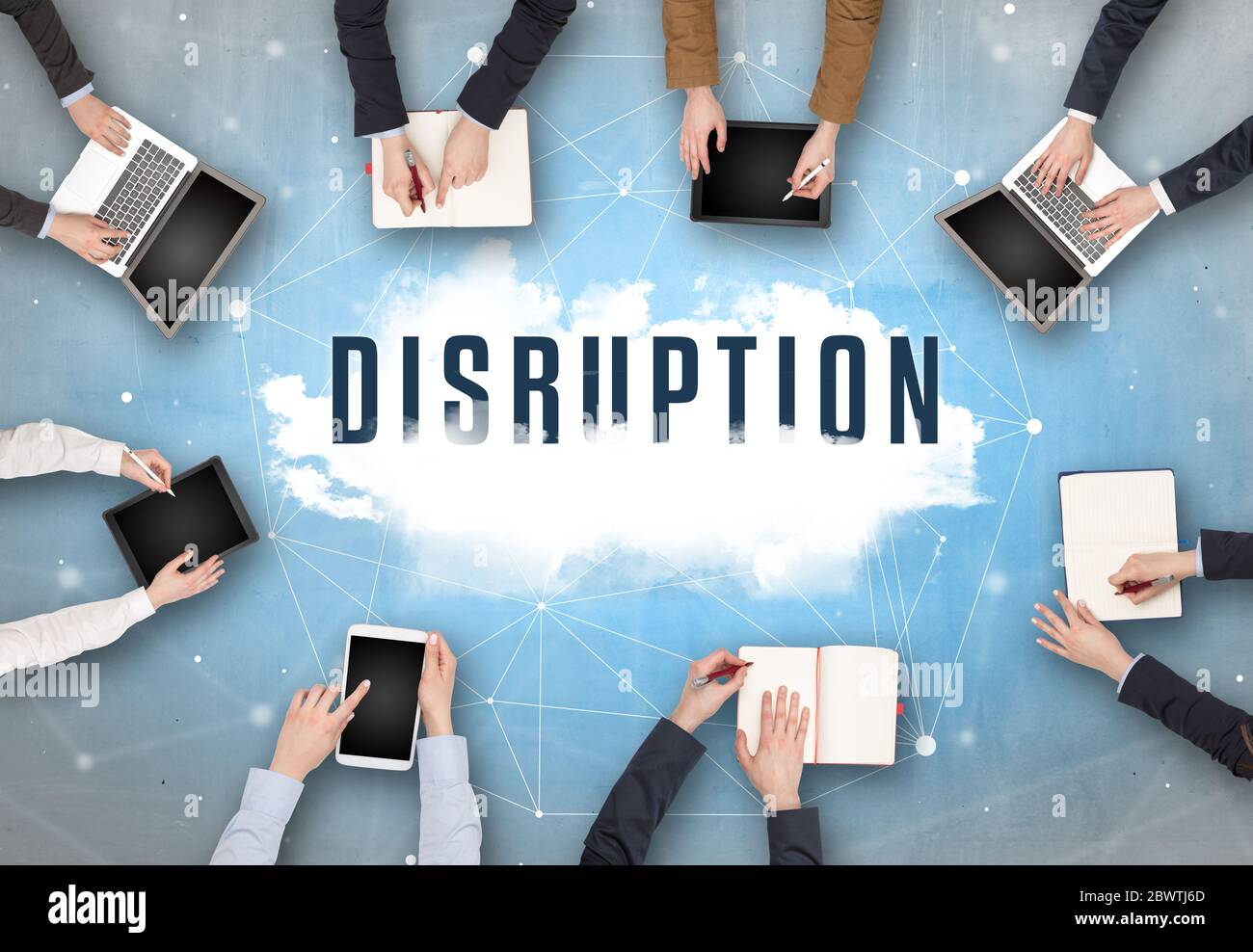 Group of people having a meeting with DISRUPTION insciption, web ...
