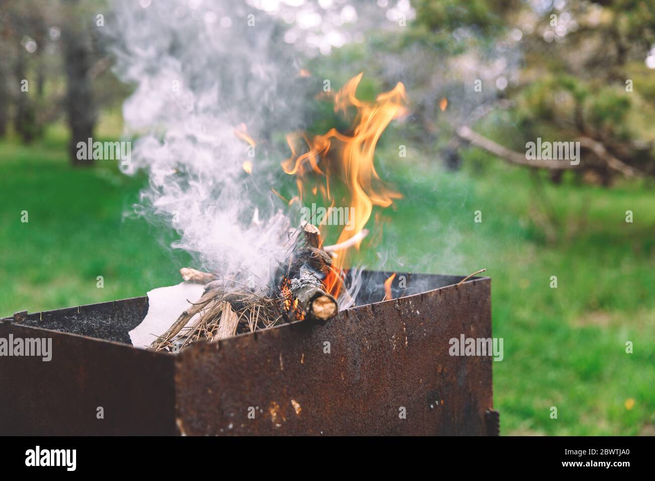Inverted fire pit with logs on the bottom and tinder on top Stock Photo ...