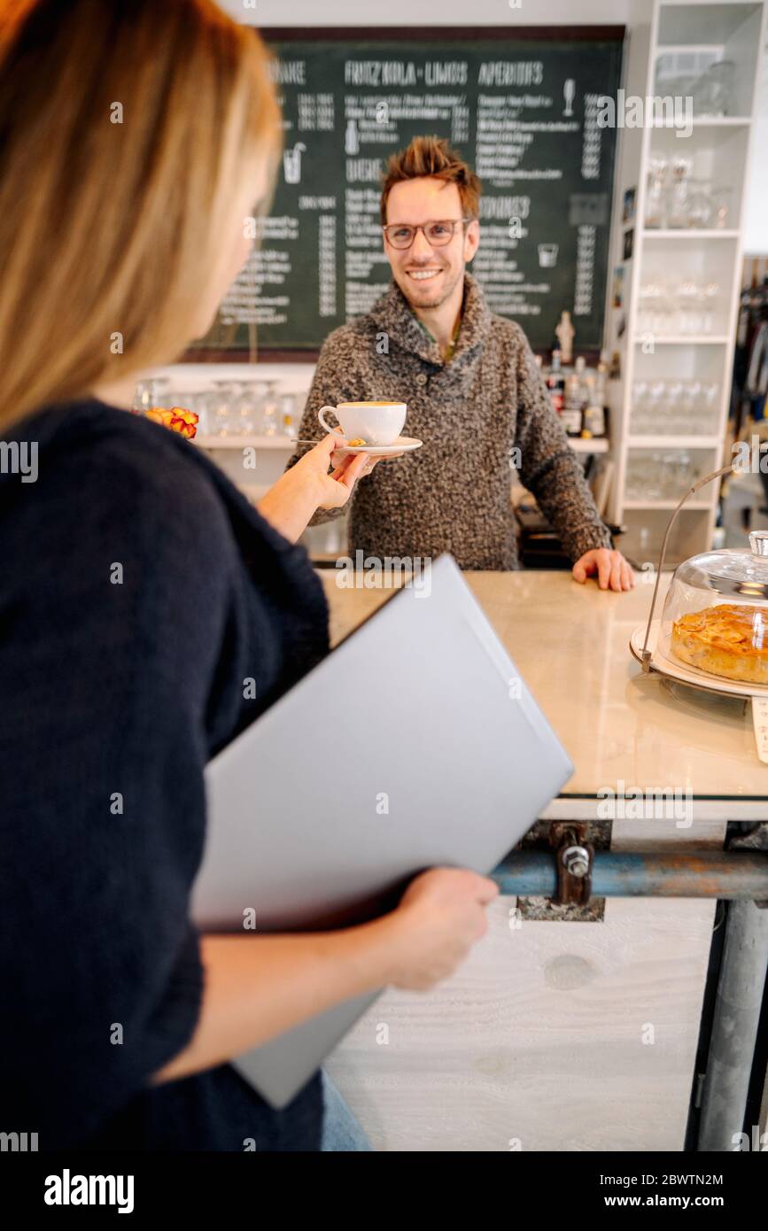 Woman ordering counter hi-res stock photography and images - Alamy