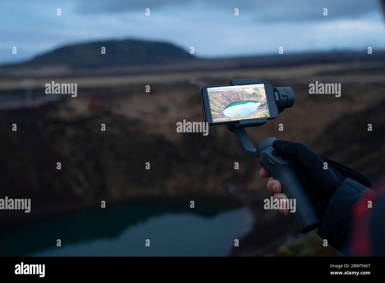 Hand person photographing crater lake hi-res stock photography and ...