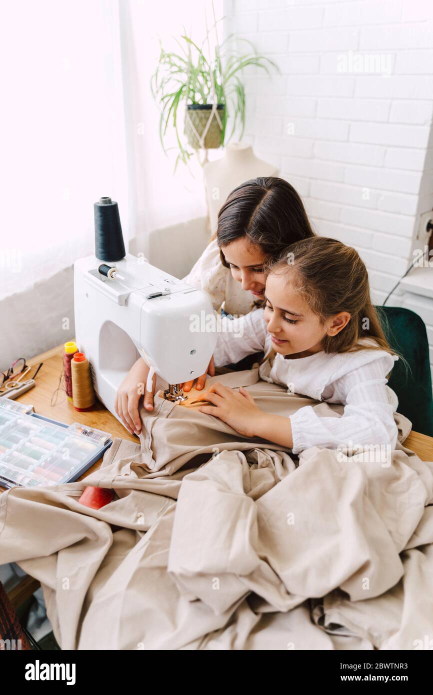 Family life sewing hi-res stock photography and images - Alamy