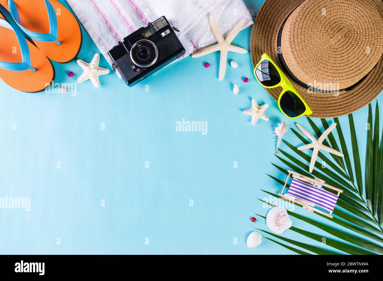 Beach accessories retro film camera, sunglasses, flip flop starfish ...