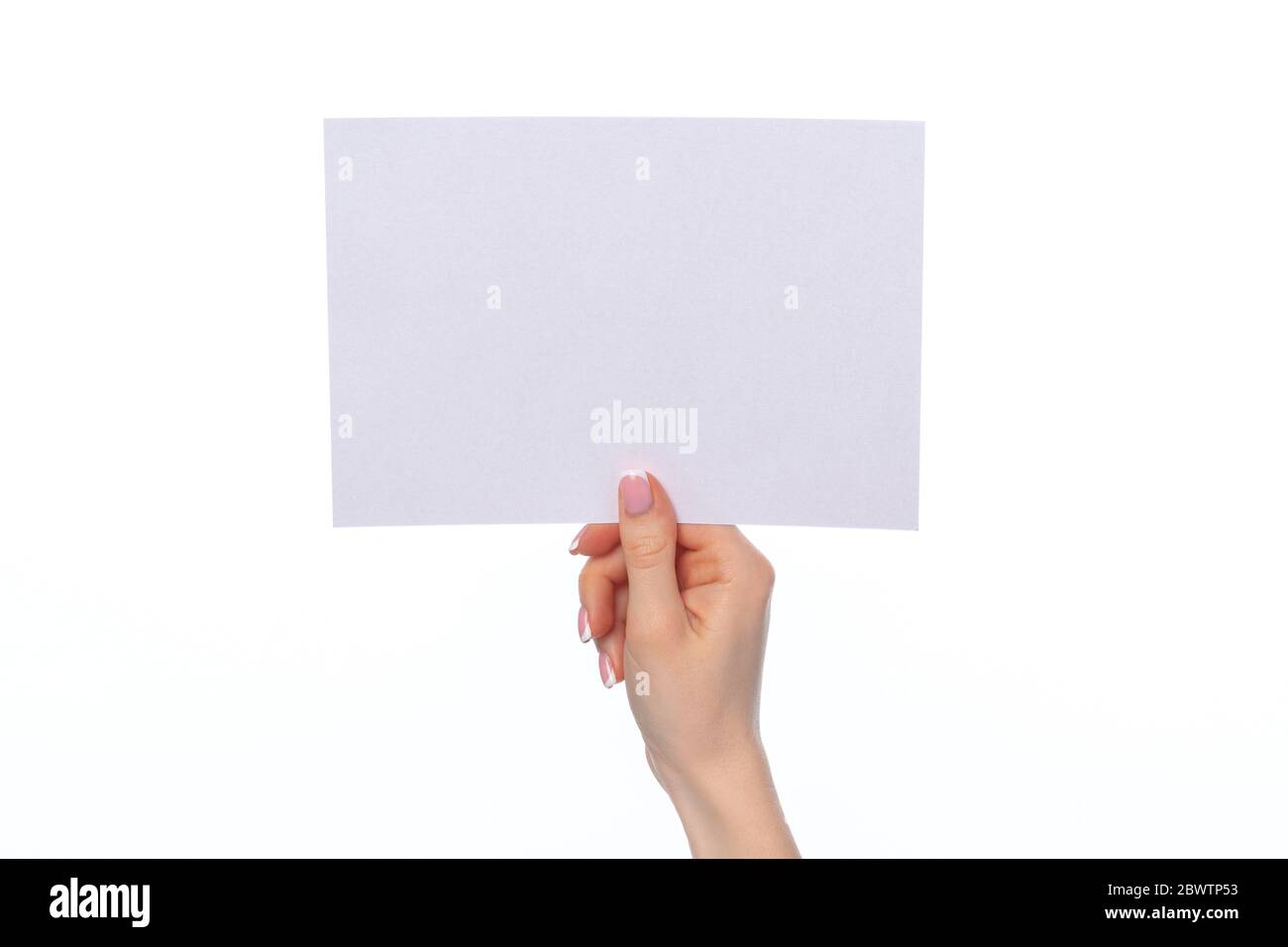 Female hand holding blank white sheet of paper isolated on white Stock ...