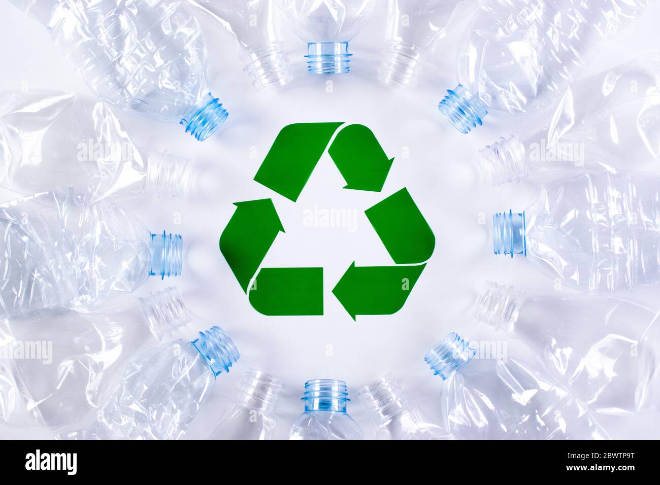 Frame of used plastic bottles background with recycle sign. Recycle and ...