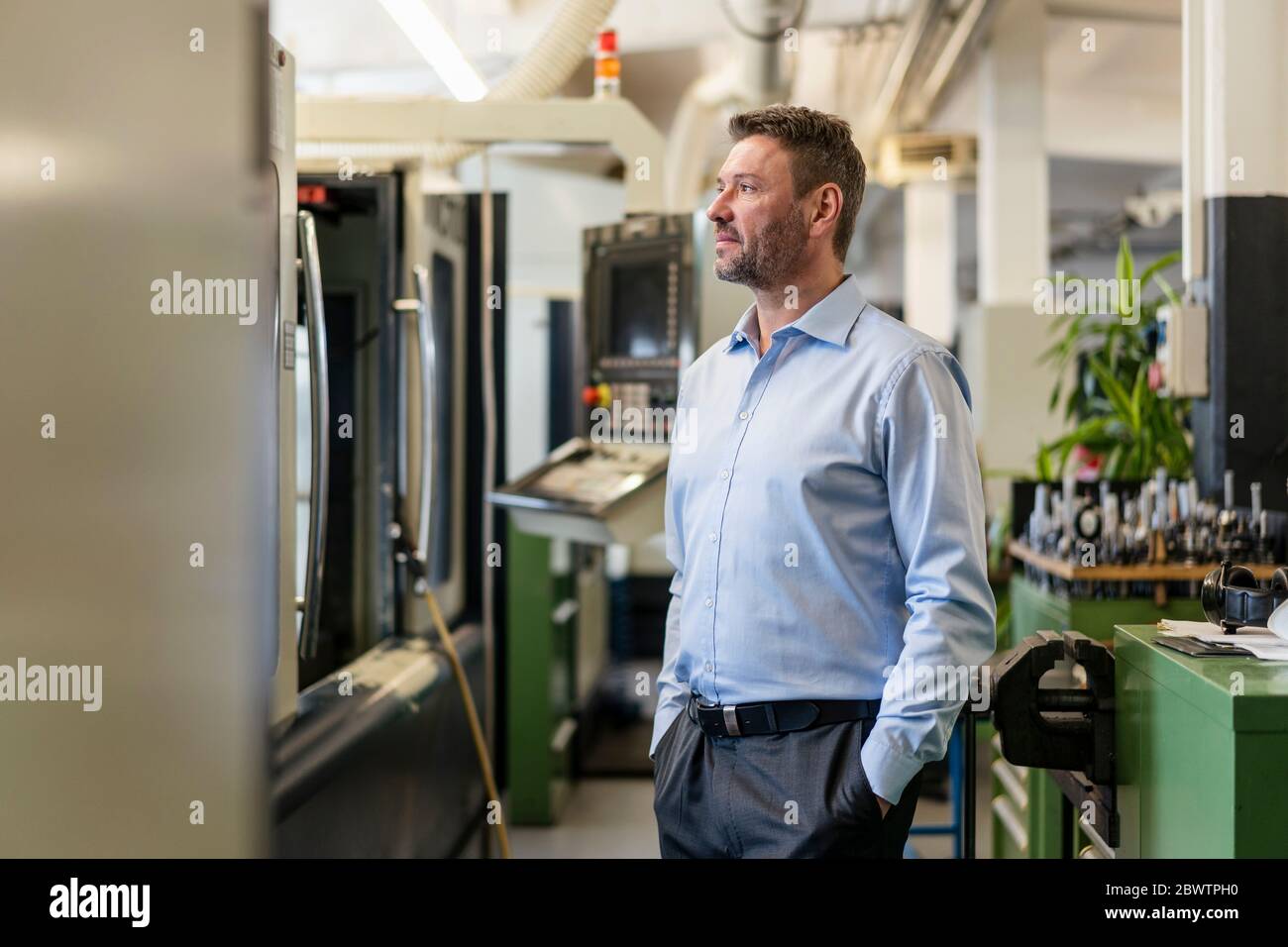 Businessman standing in shop floor hi-res stock photography and images ...