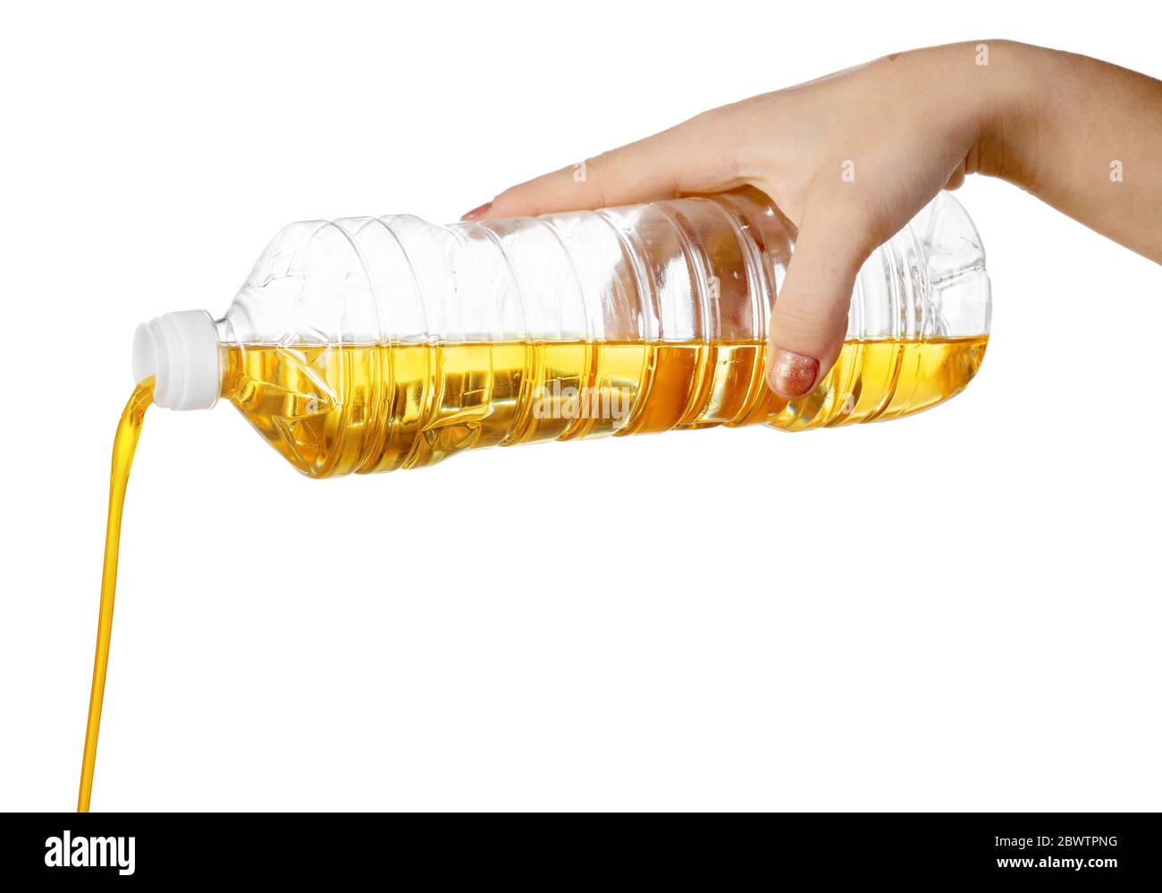 Hand of woman pouring cooking oil from plastic bottle. Isolated on ...