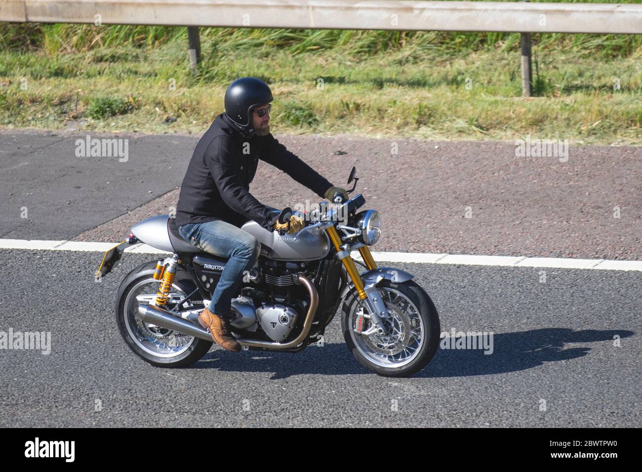 Triumph Thruxton Motorbike rider; two wheeled transport, motorcycles ...