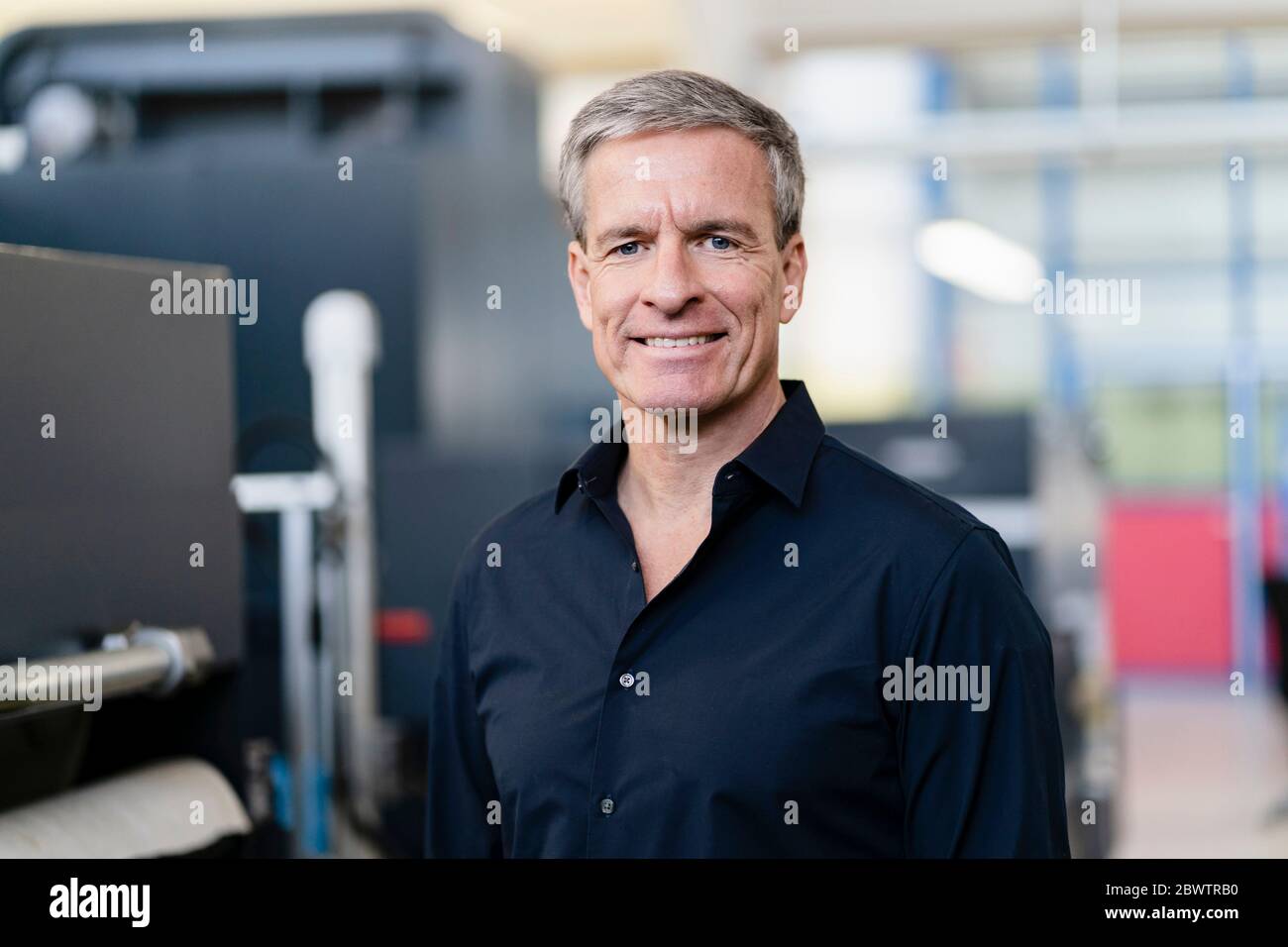 Successful entrepreneur in his company, portrait Stock Photo - Alamy