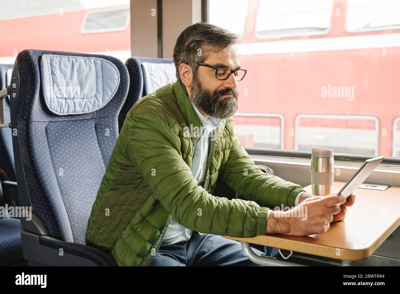 Man working computer on train hi-res stock photography and images - Alamy
