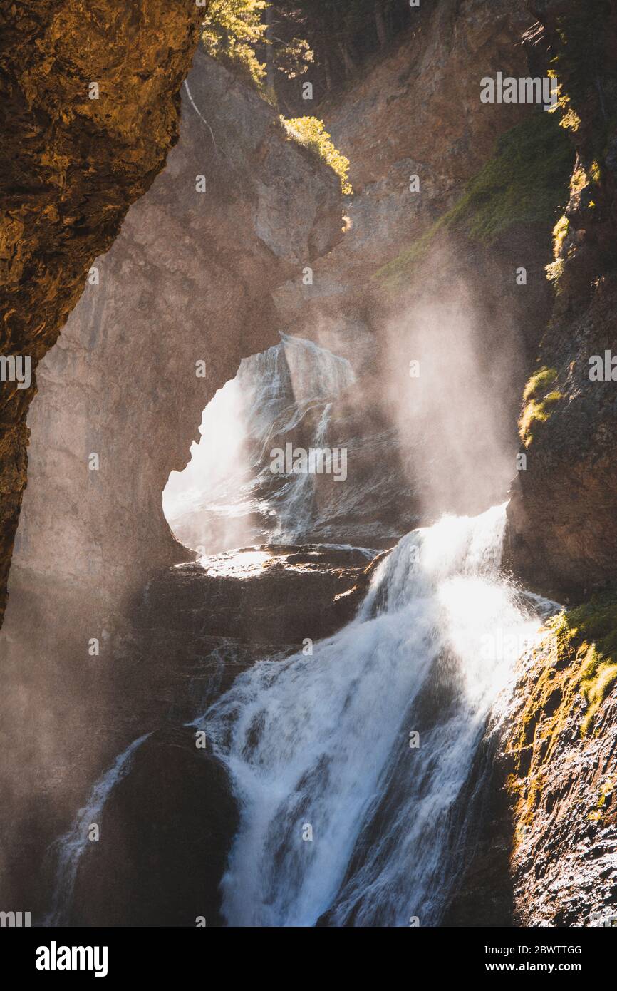 Cave over splashing waterfall hi-res stock photography and images - Alamy