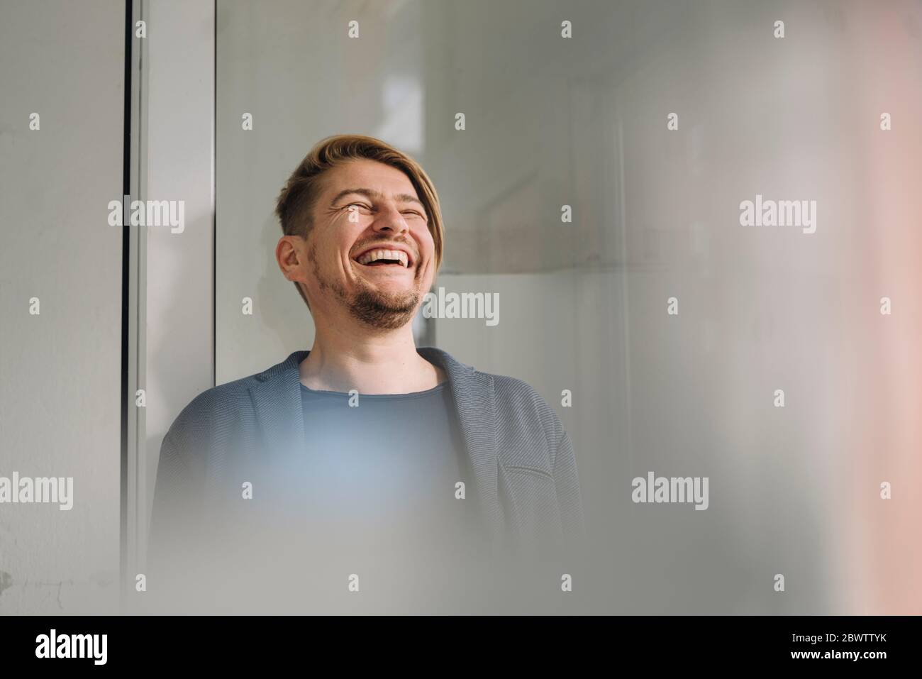 Portrait of laughing businessman Stock Photo - Alamy