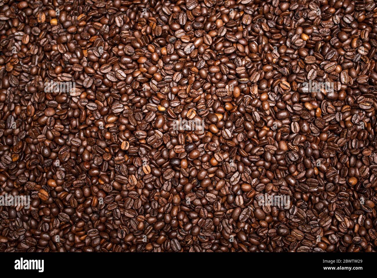 Coffee beans background view from above Stock Photo - Alamy