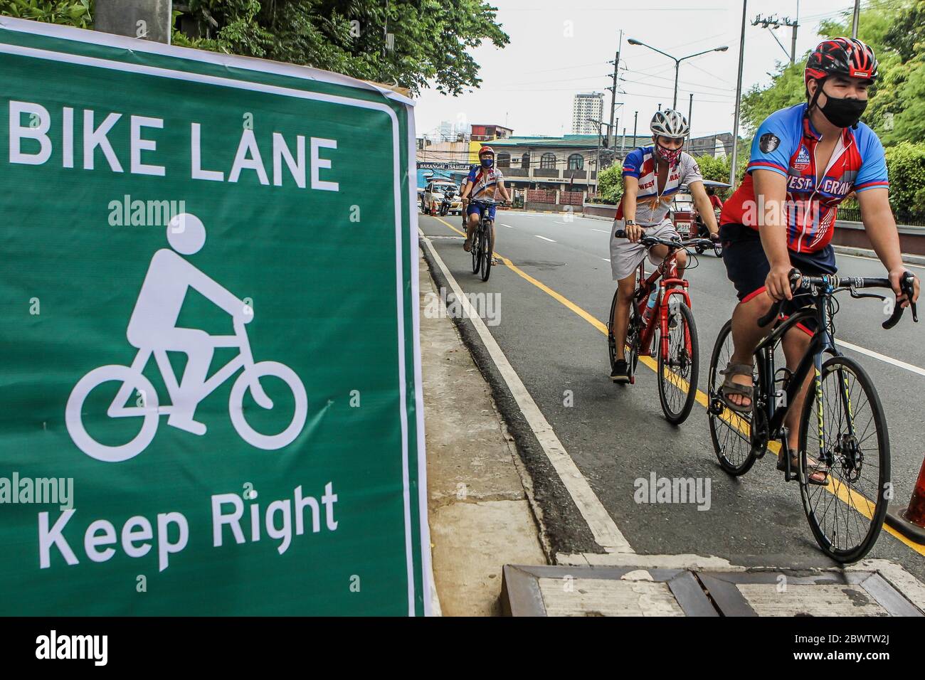 Manila, Philippines. 3rd June, 2020. People ride their bicycles along ...