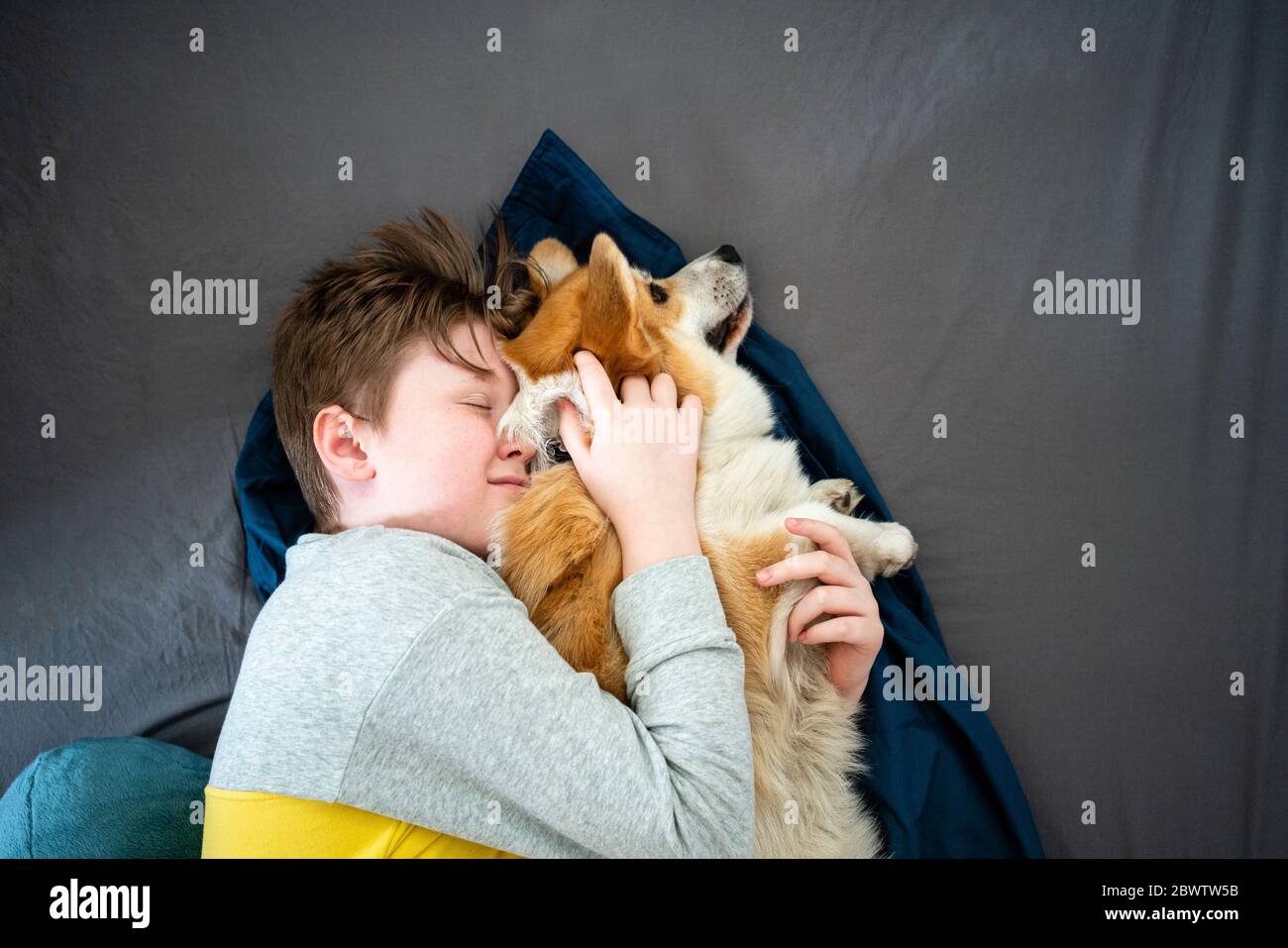 Boy With Dog Cuddling Animals High Resolution Stock Photography and ...