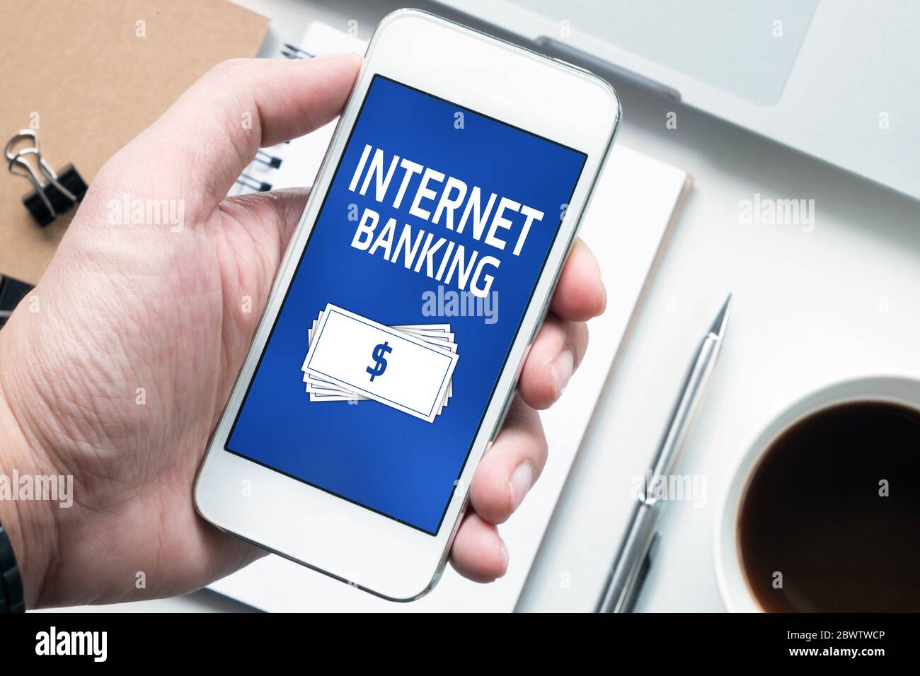 Hand holding smartphone with internet banking application concept. Top ...